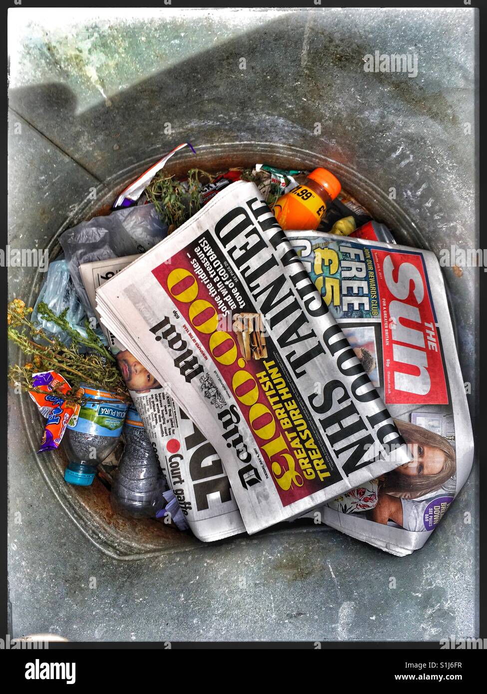 Tabloids dumped in a rubbish Bin Stock Photo - Alamy