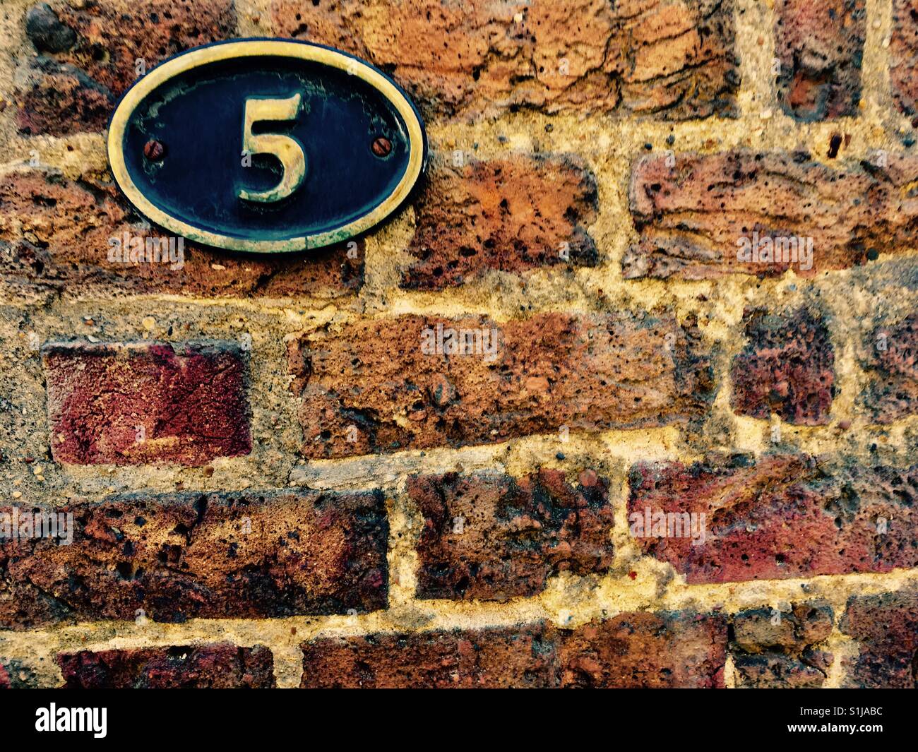 Number 5 on a brick wall of a. House in London in England Stock Photo ...