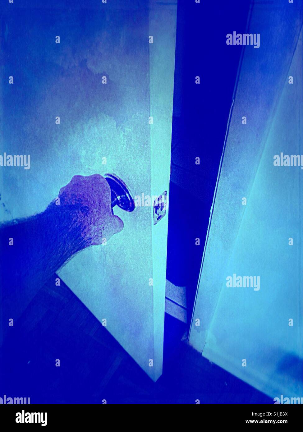 Hand reaching for door knob hi-res stock photography and images - Alamy