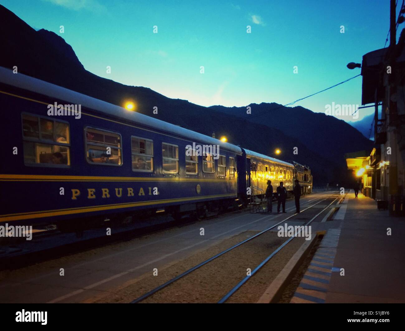 Perurail train going to Macchu Picchu making stop at Ollantaytambo in ...