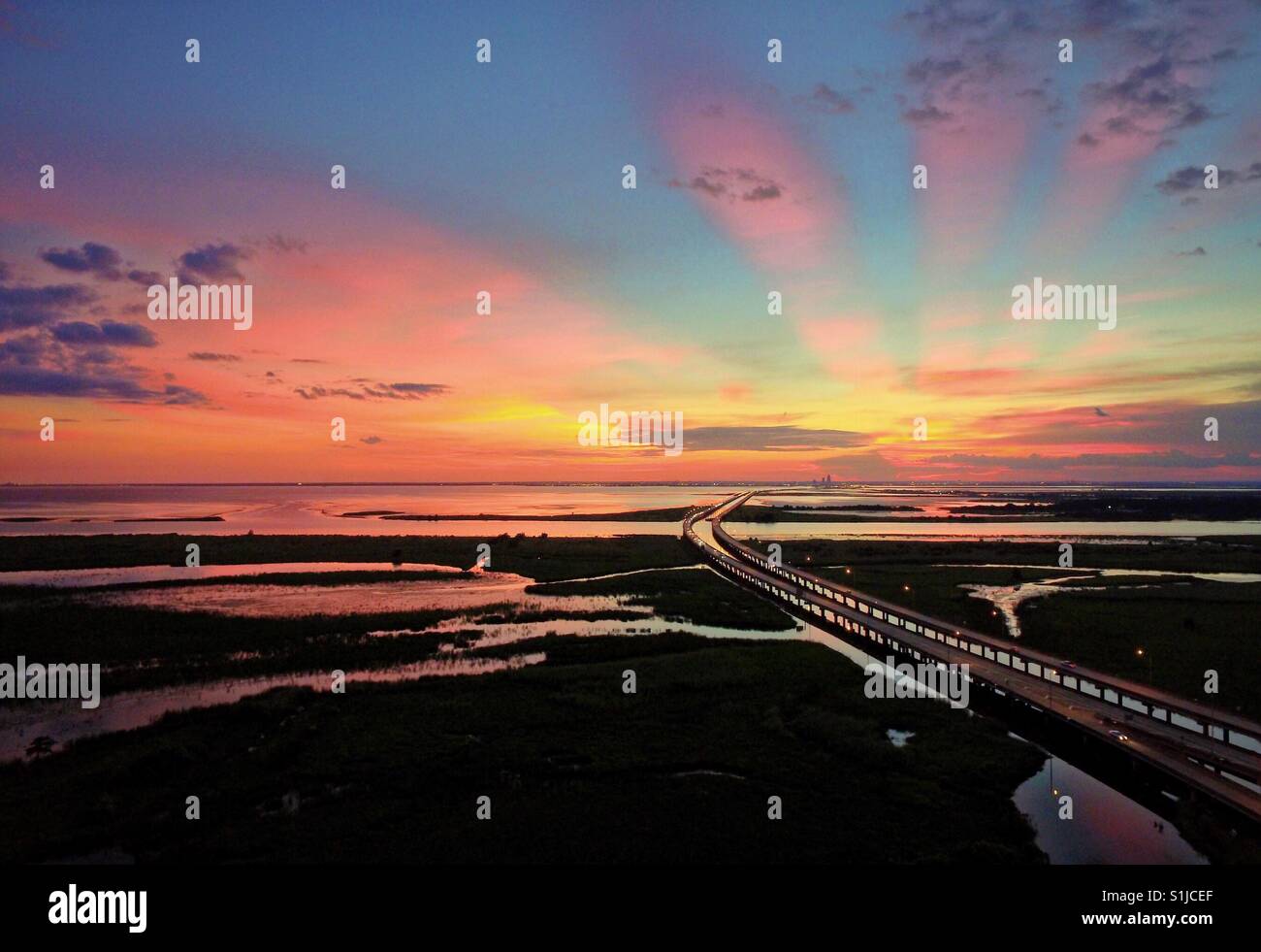 Sun rays over Mobile Stock Photo - Alamy