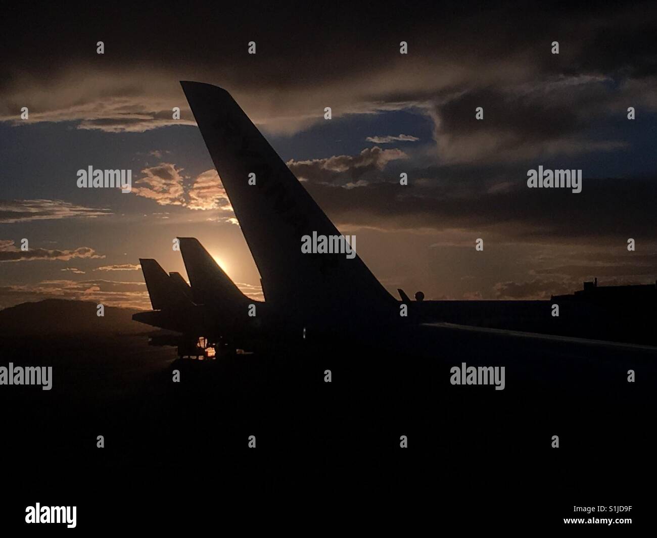 Airplanes at sunset in Valencia Airport Stock Photo - Alamy