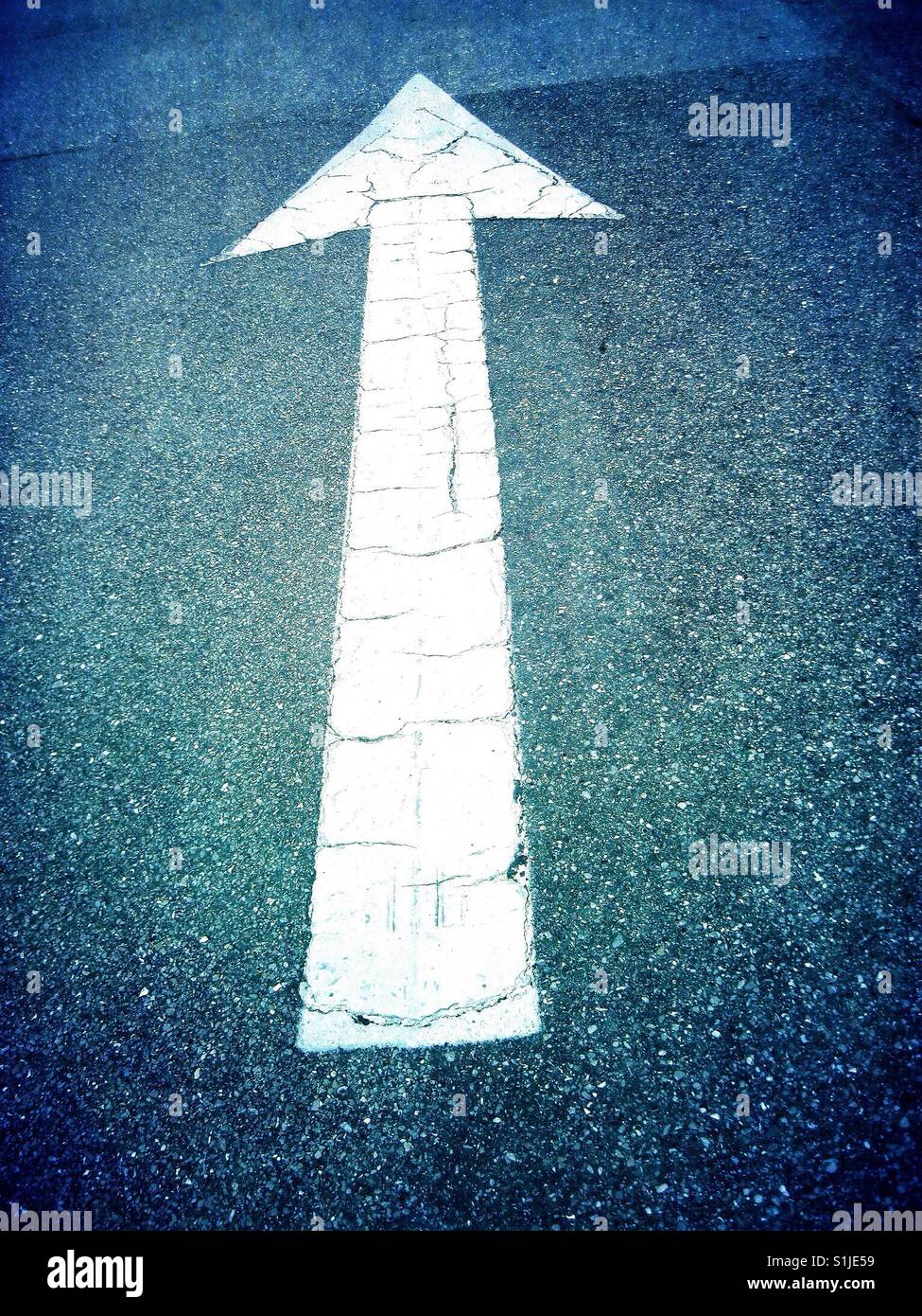 close up arrow sign on road Stock Photo - Alamy