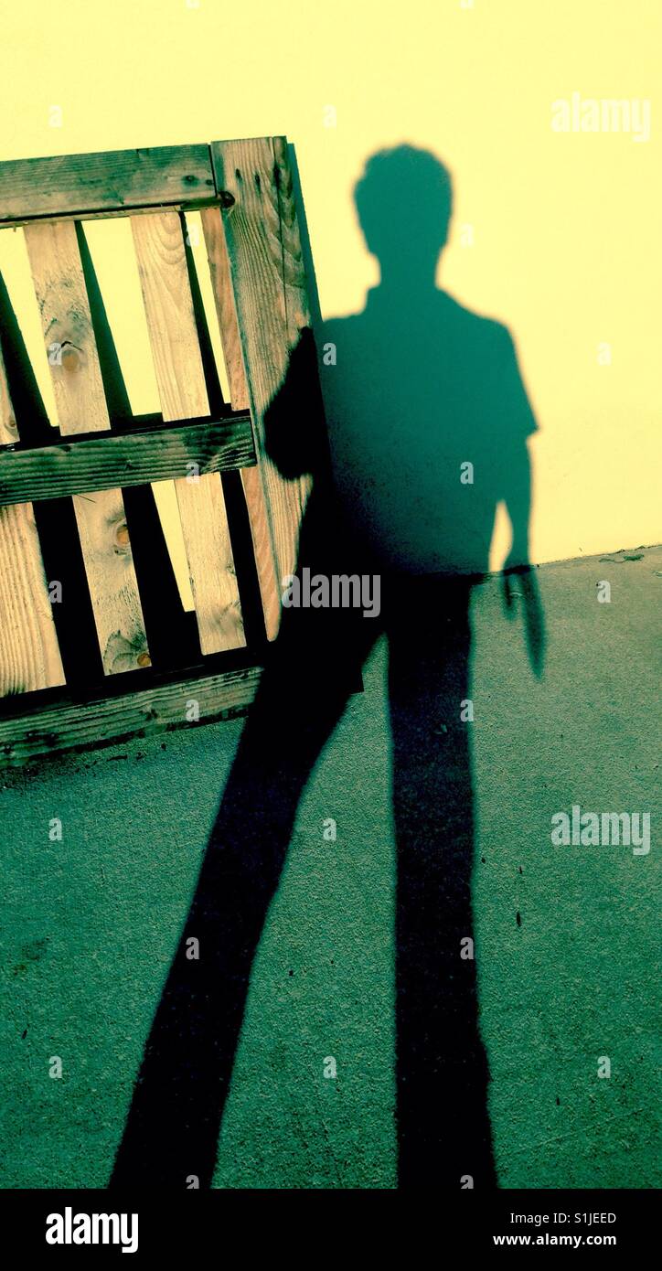 Mans shadow back alley hi-res stock photography and images - Alamy