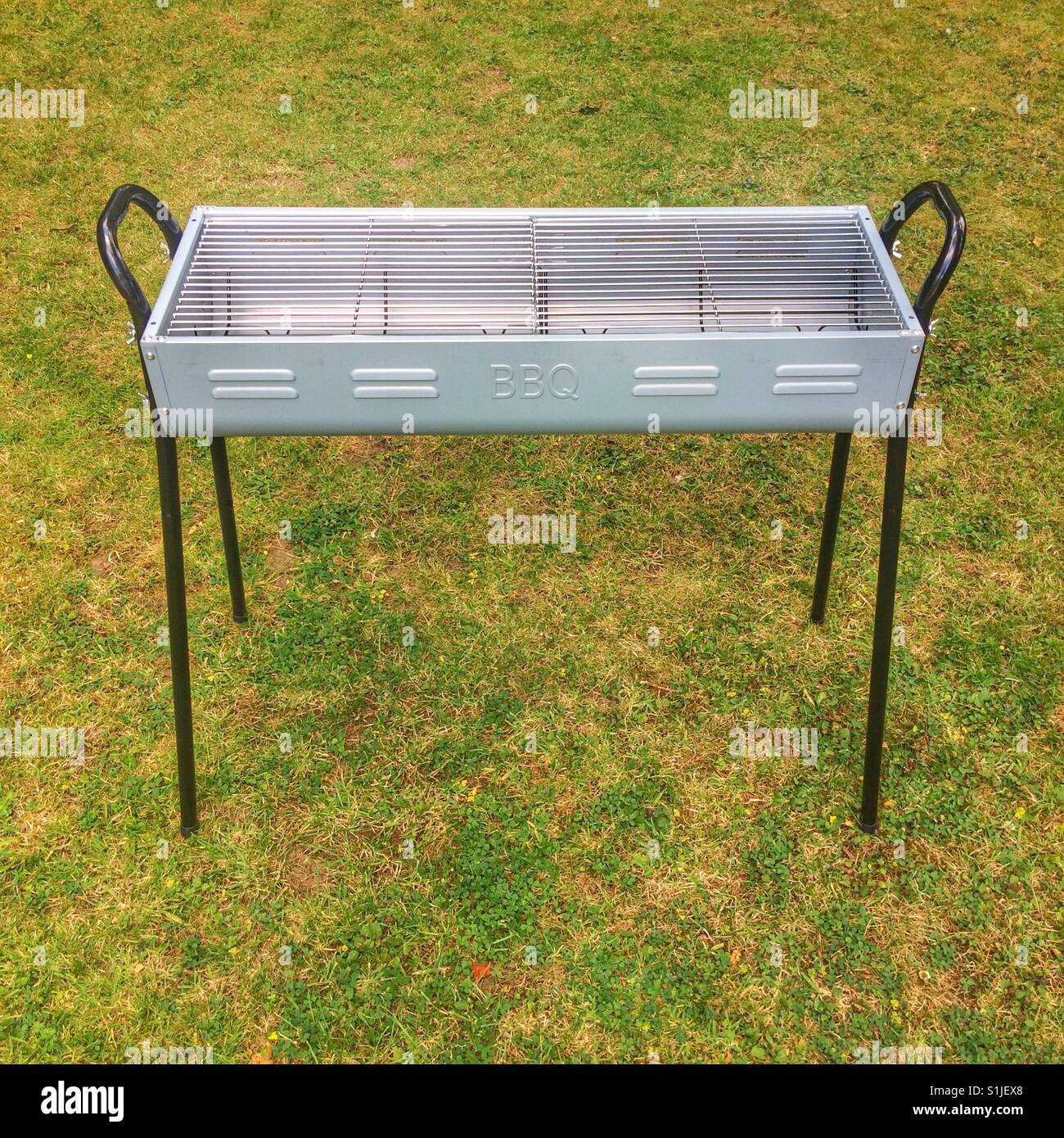 Metal charcoal barbecue Stock Photo - Alamy