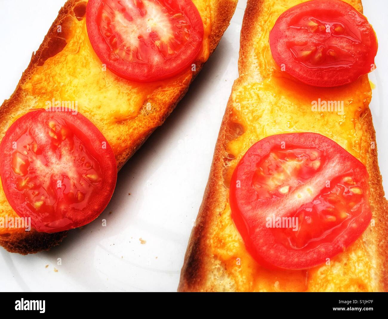 Toasted Red Leicester cheese on French stick Stock Photo - Alamy