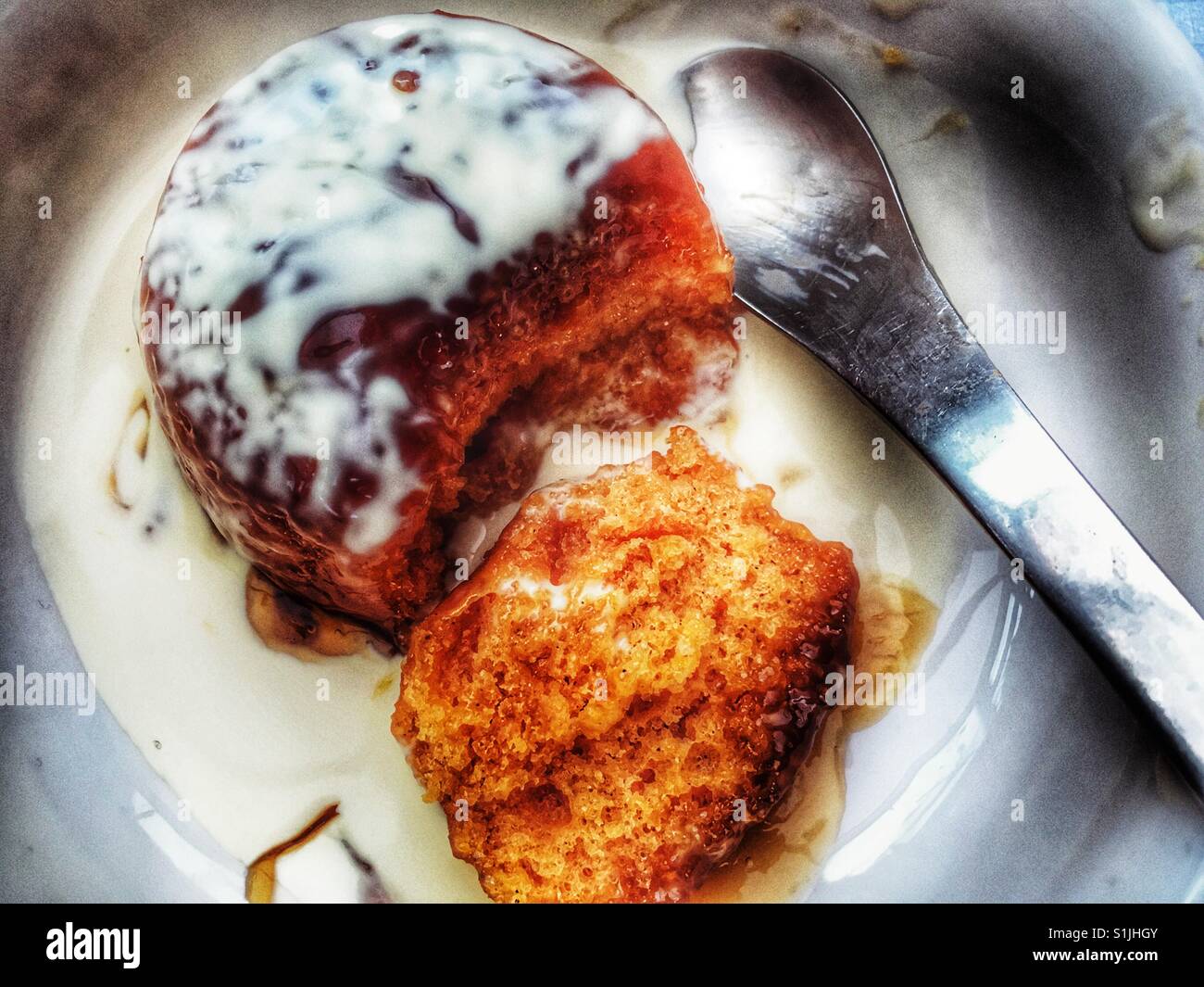 Golden syrup pudding with cream Stock Photo - Alamy