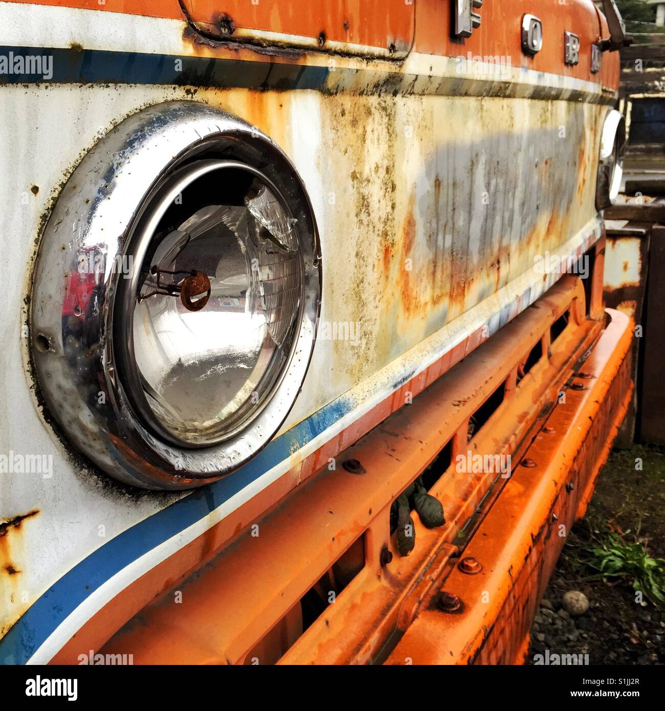 Broken headlight and front of a rusty vintage Ford truck Stock Photo ...