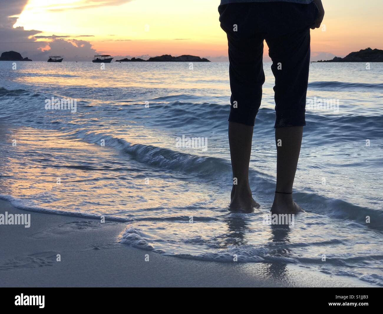 Boy Wading Into Water High Resolution Stock Photography and Images - Alamy
