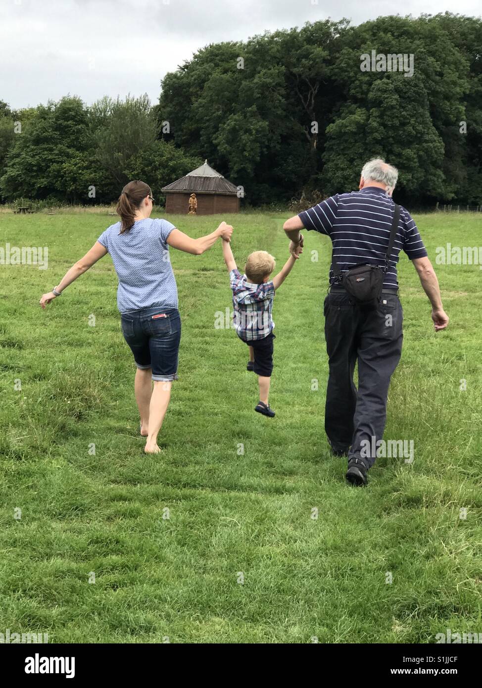 Two adults one child hi-res stock photography and images - Alamy