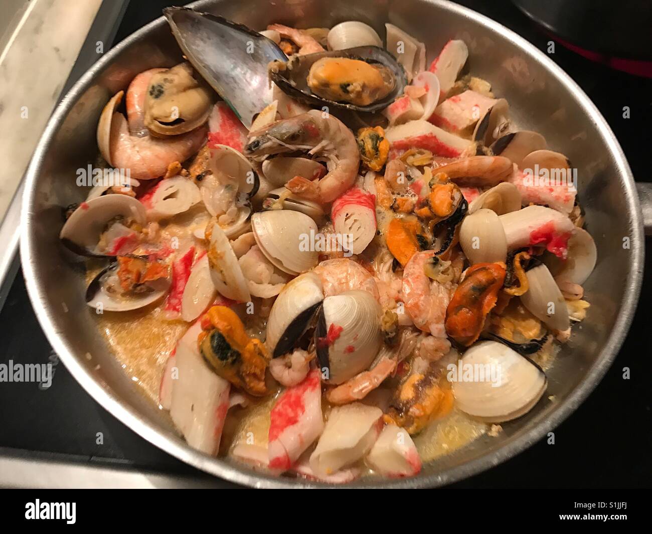 Cooking seafood at home Stock Photo - Alamy