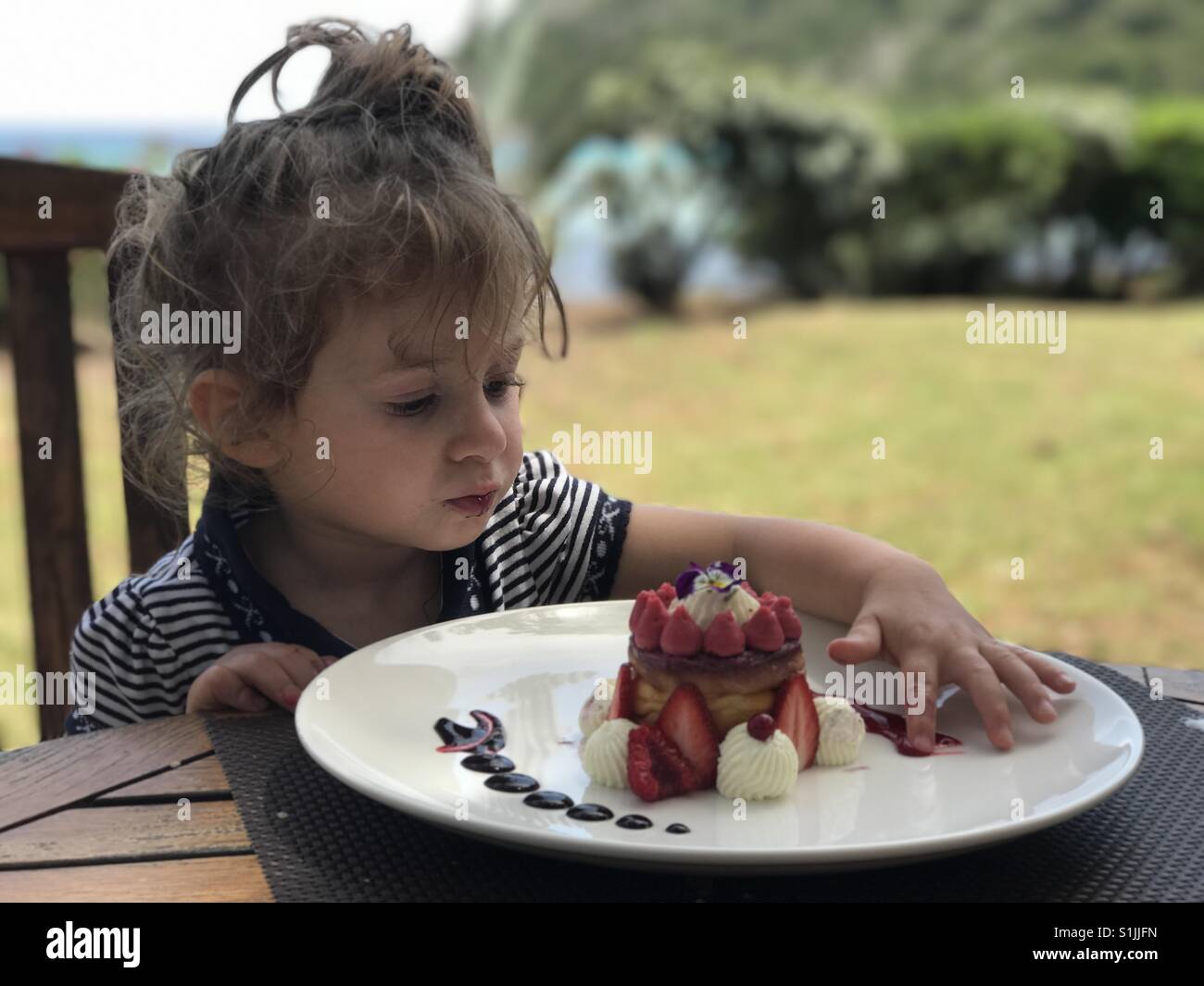 Children eating a dessert Stock Photo - Alamy