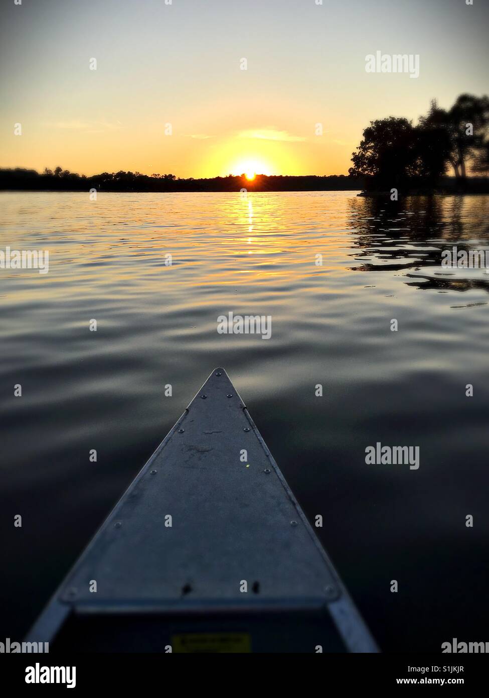 Canoeing at sunset hi-res stock photography and images - Alamy