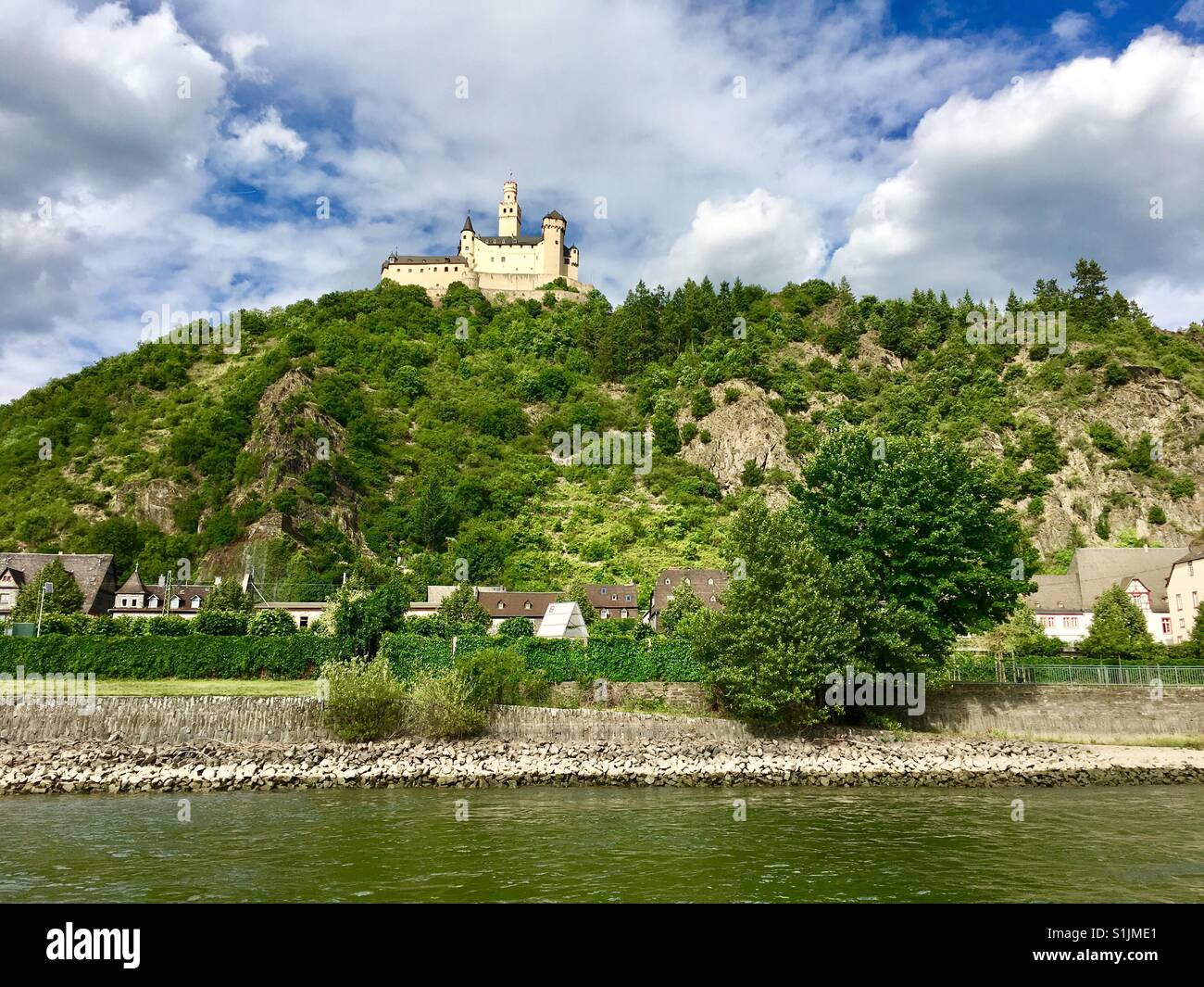Marksburg castle above the town of Braubach, Germany along the Rhine ...
