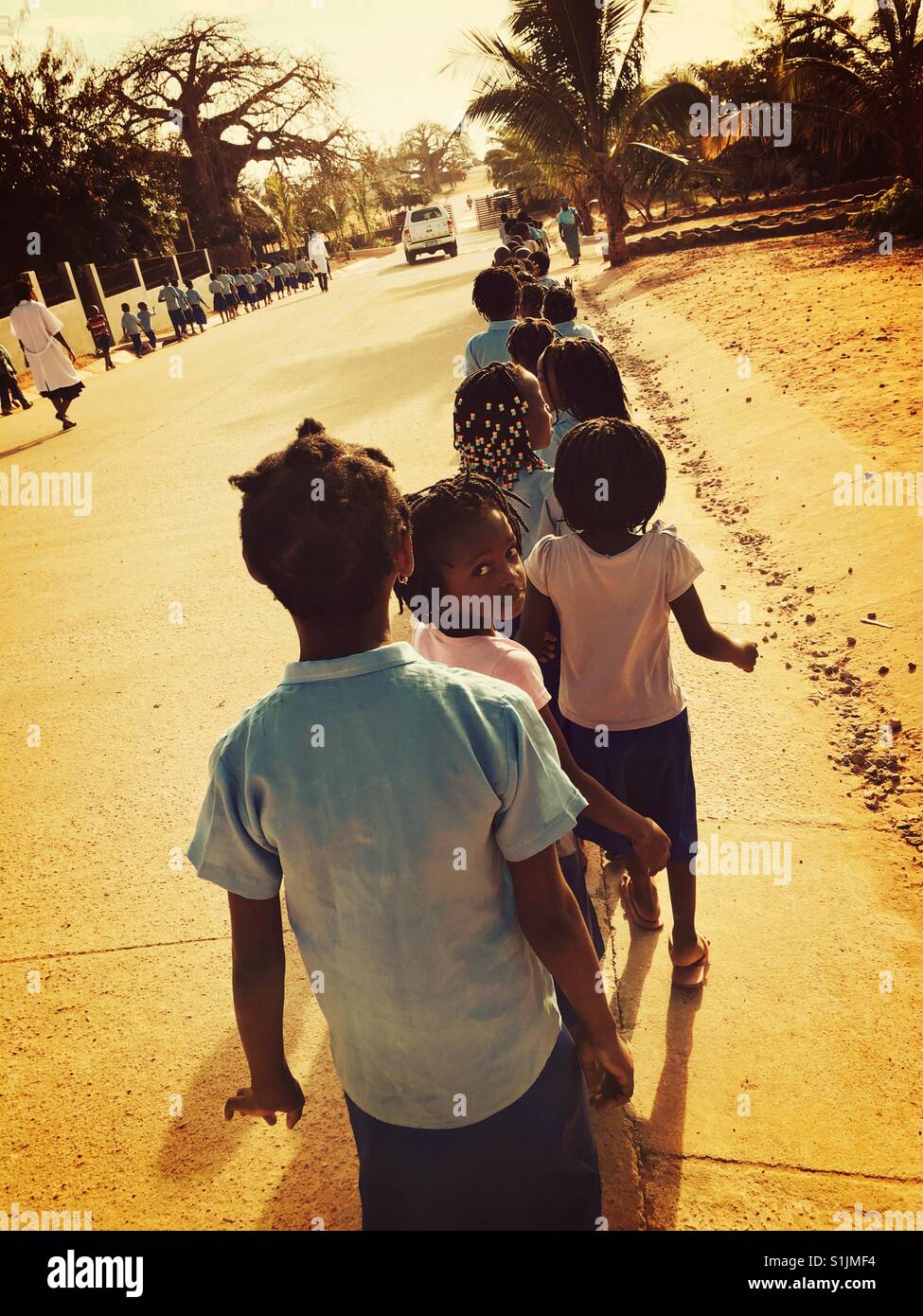 School children row walking hi-res stock photography and images - Alamy