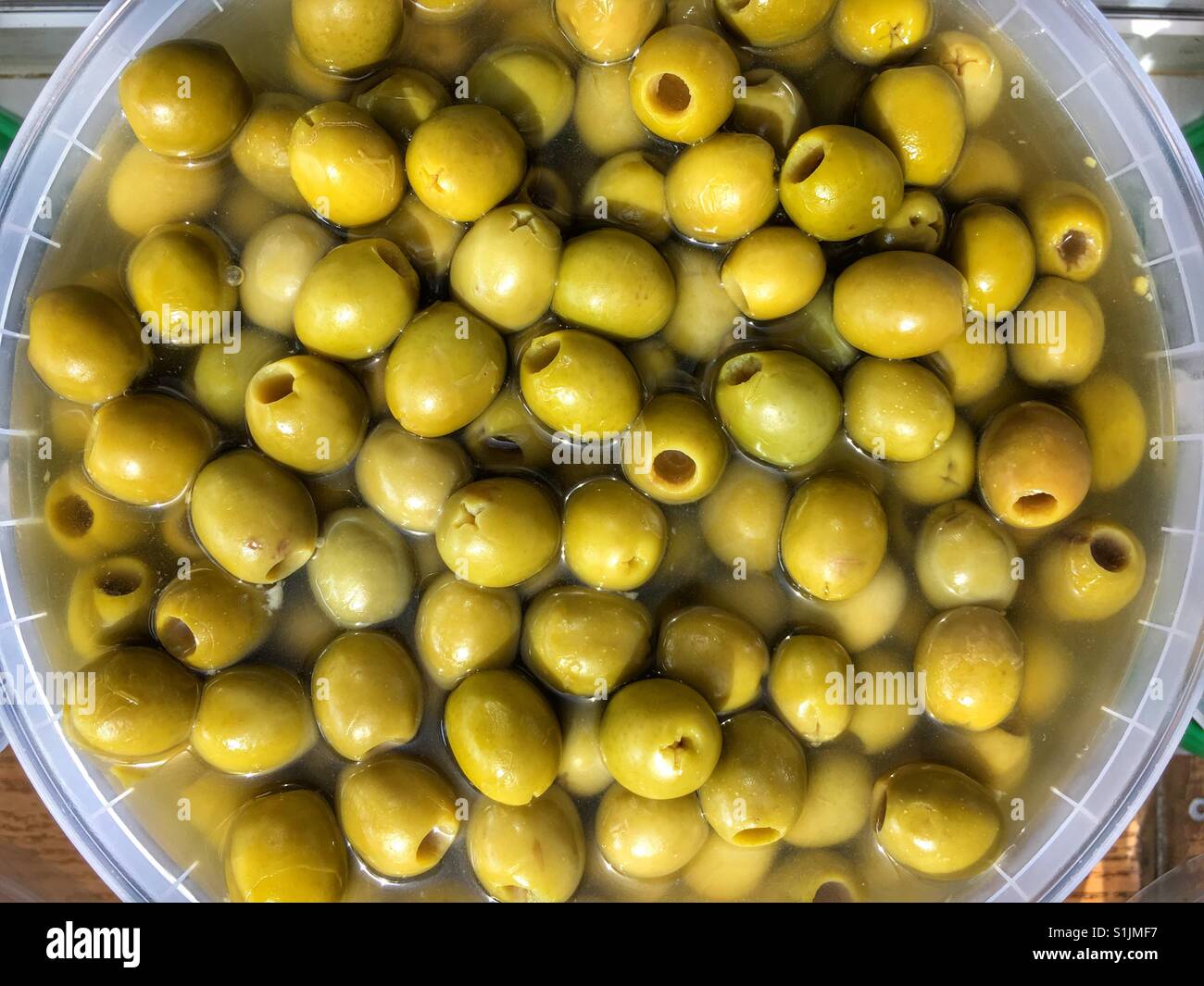 Plain green olives on a Spanish market stall Stock Photo - Alamy