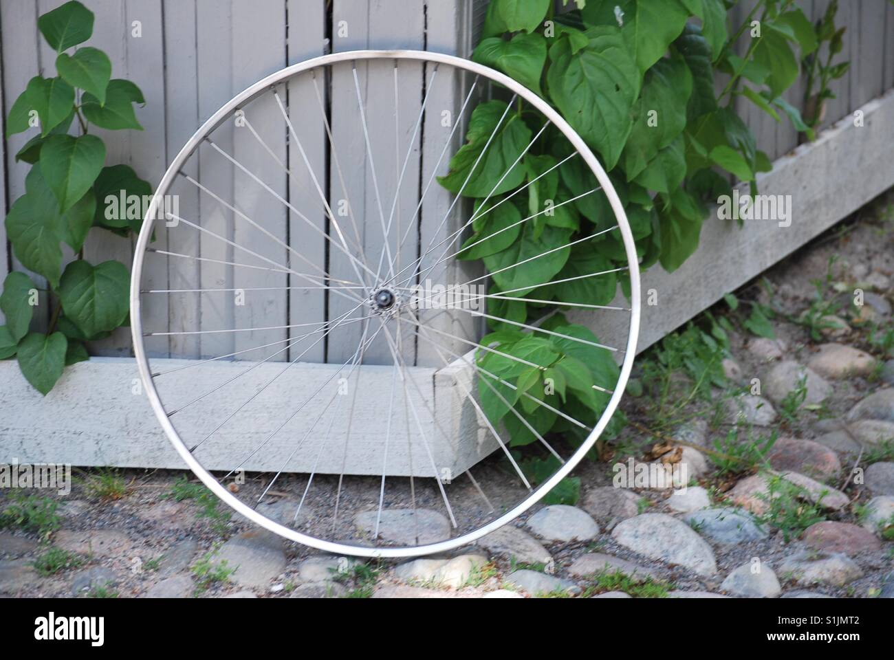 Bike against fence hi-res stock photography and images - Alamy