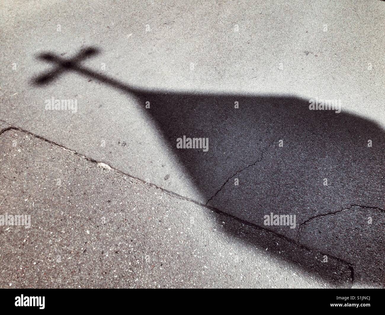 Shadow of a church tower with cross on the pavement Stock Photo - Alamy