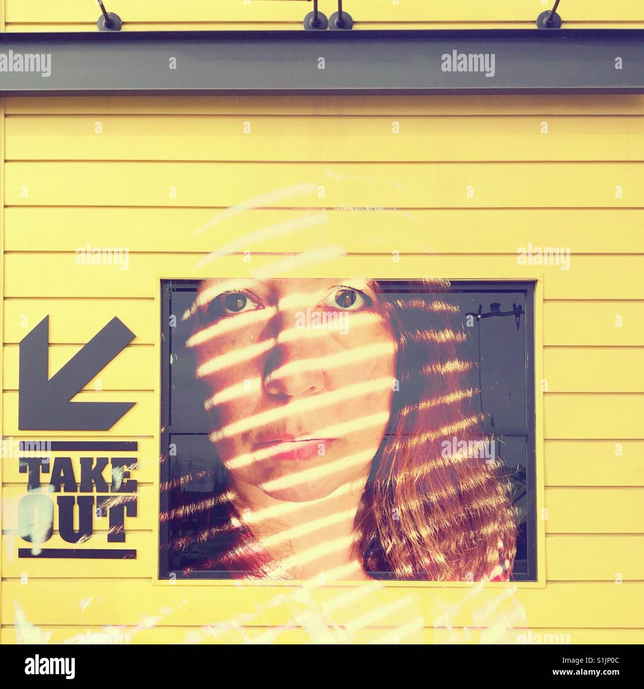 Woman's Face on Window Take Out Stock Photo - Alamy