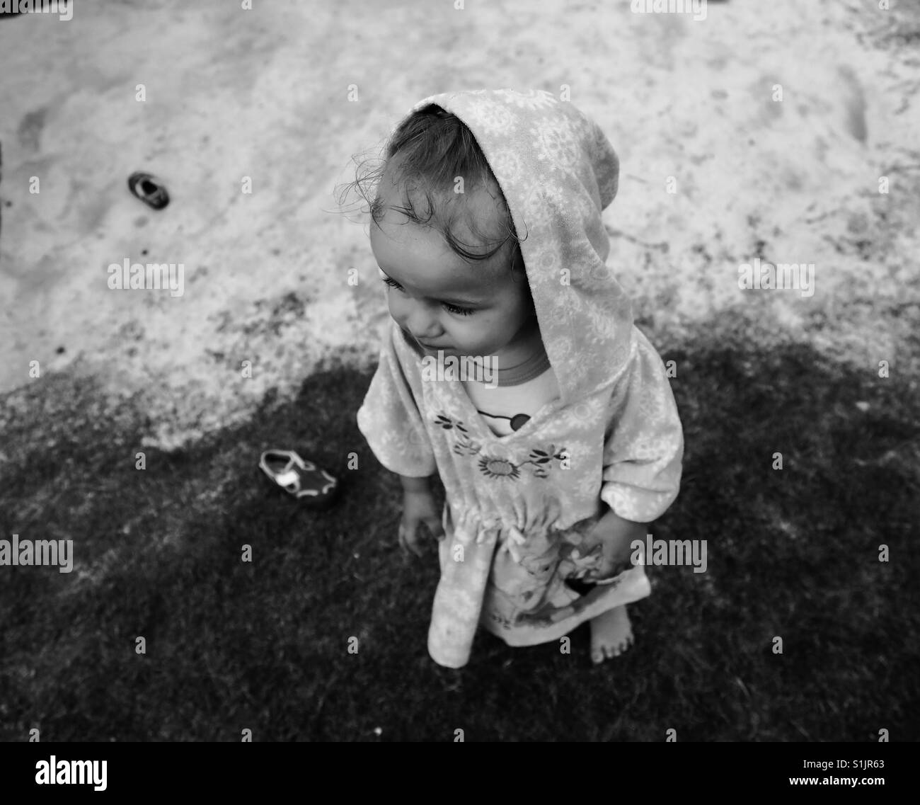 Baby in beach robes Stock Photo - Alamy