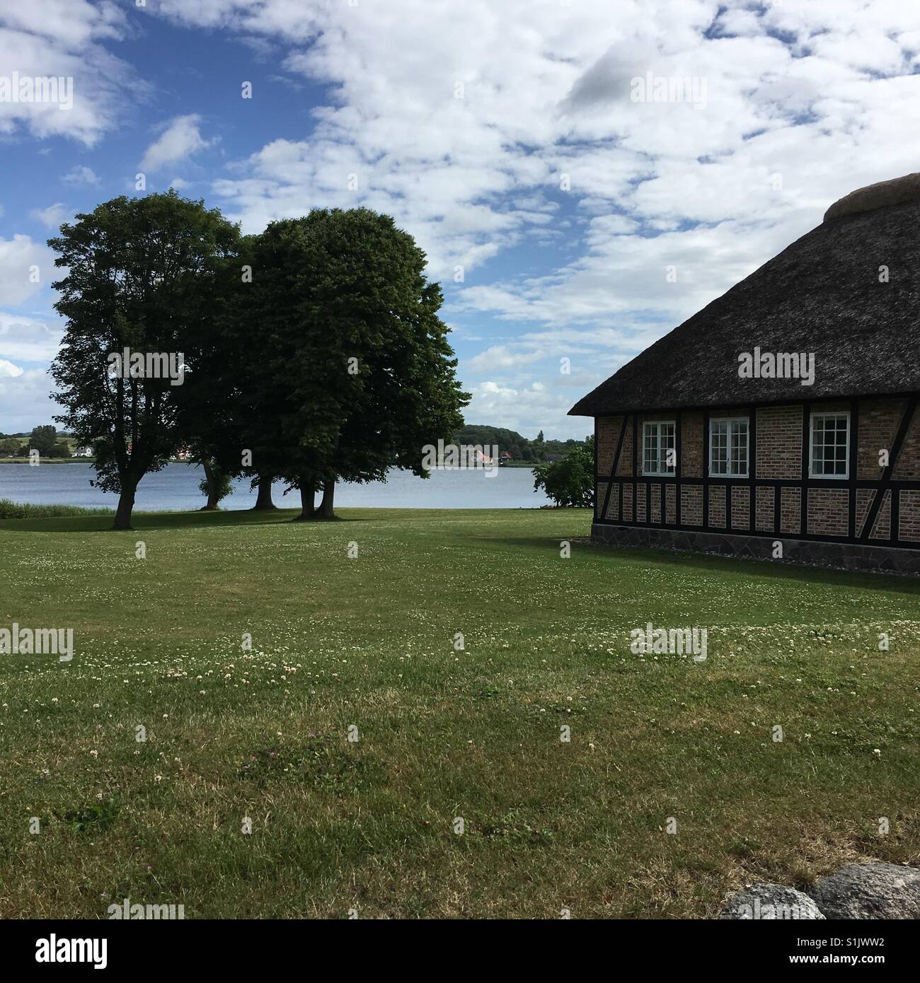 House at lake in Denmark Stock Photo - Alamy