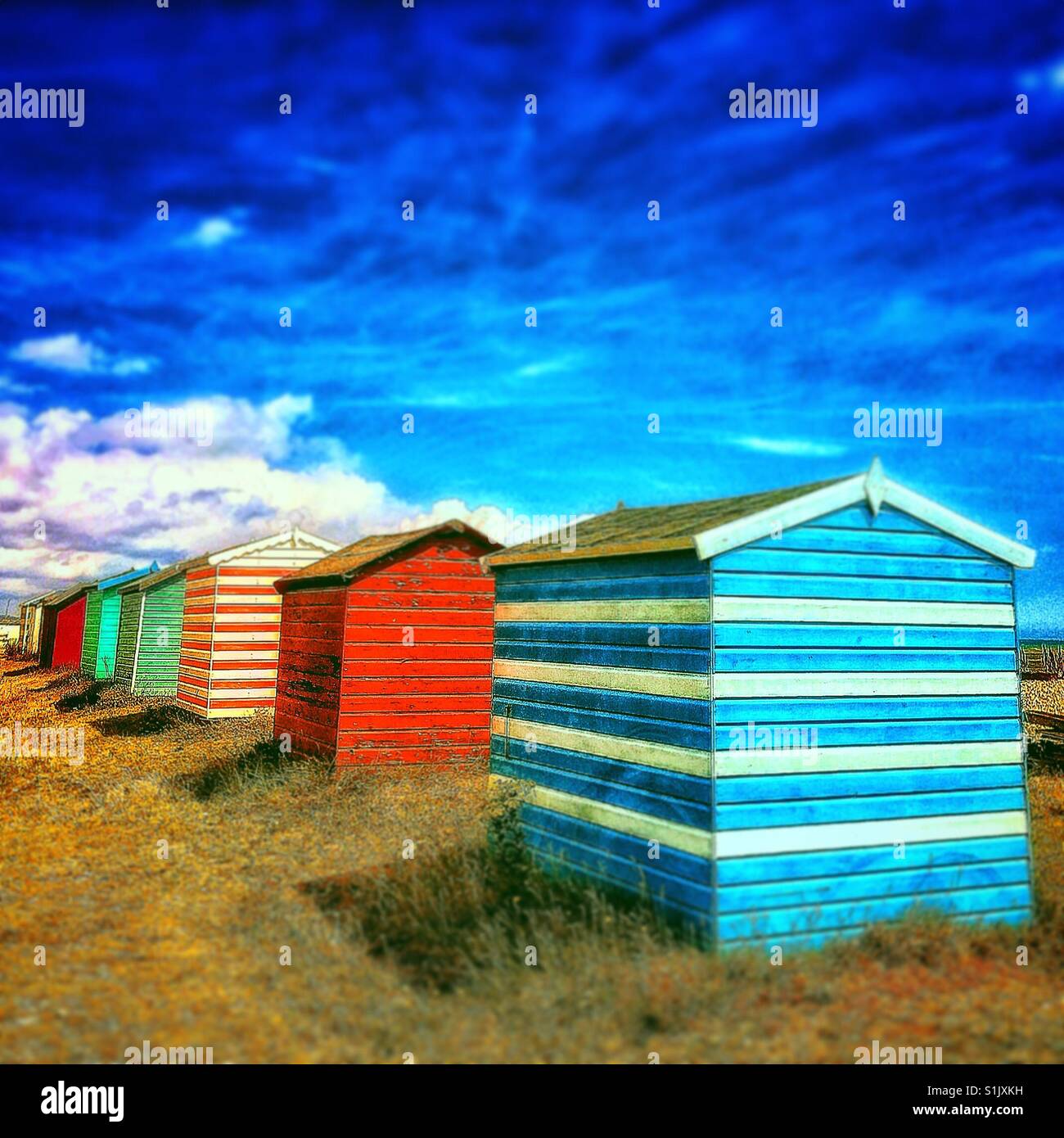 Colourful beach huts in Littlestone Kent Stock Photo - Alamy