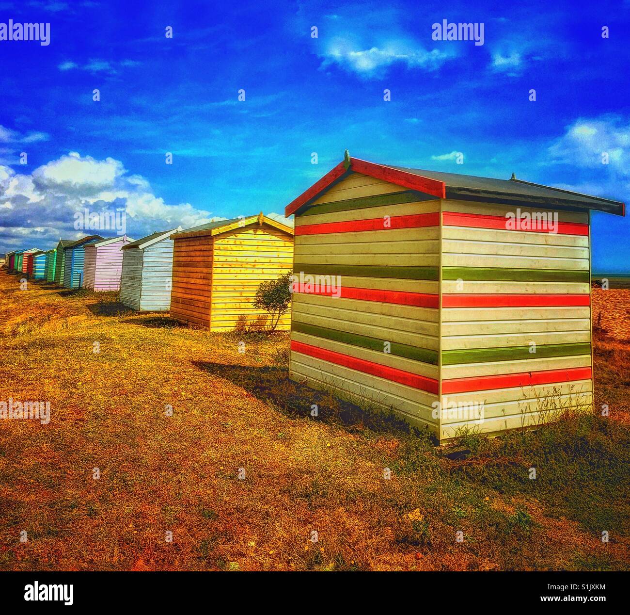 Colourful beach huts Stock Photo - Alamy