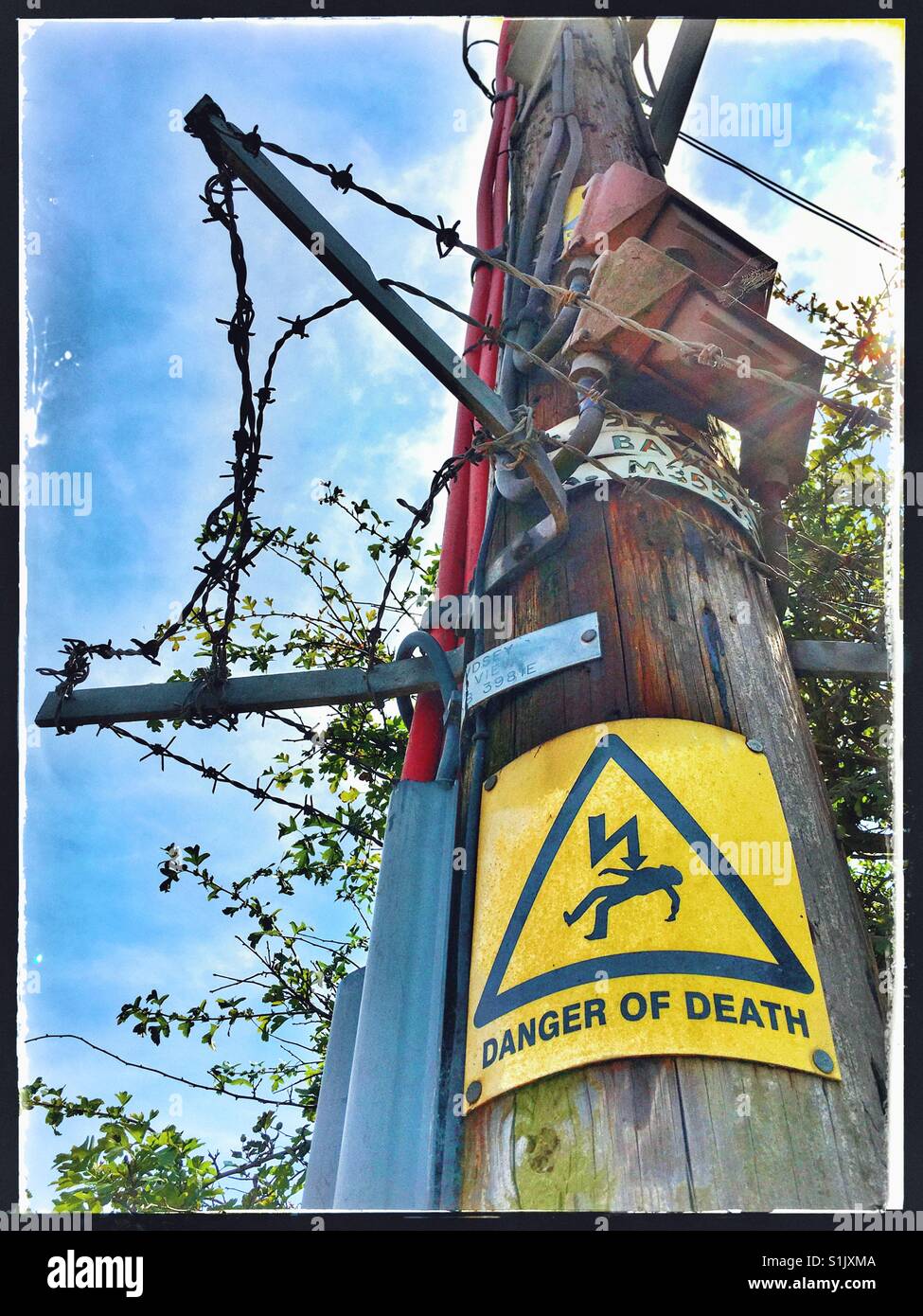 Danger of death sign on Electricity Pole Stock Photo - Alamy