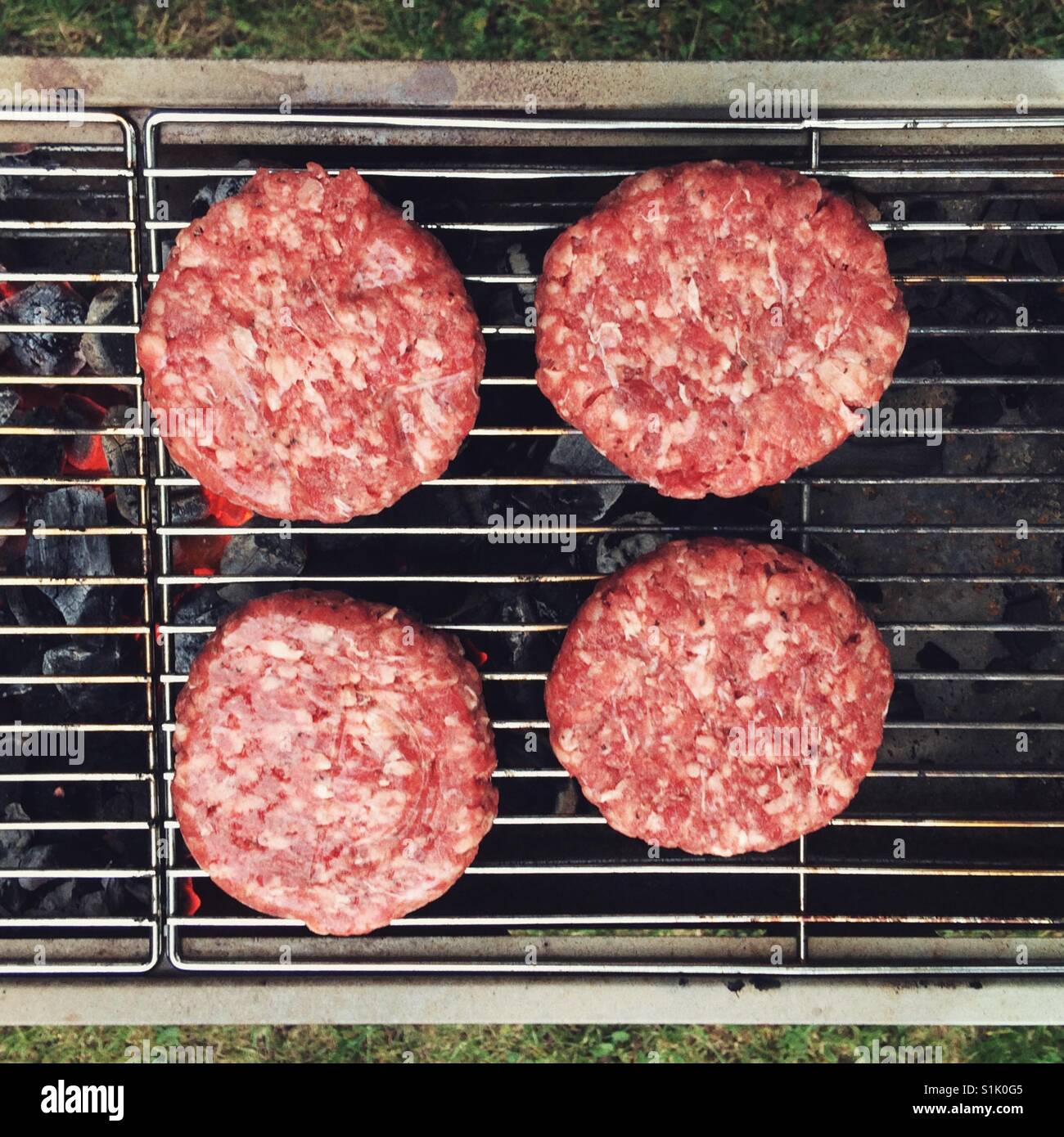 Cook patties burgers on grill smartphone stock photos and images - Alamy