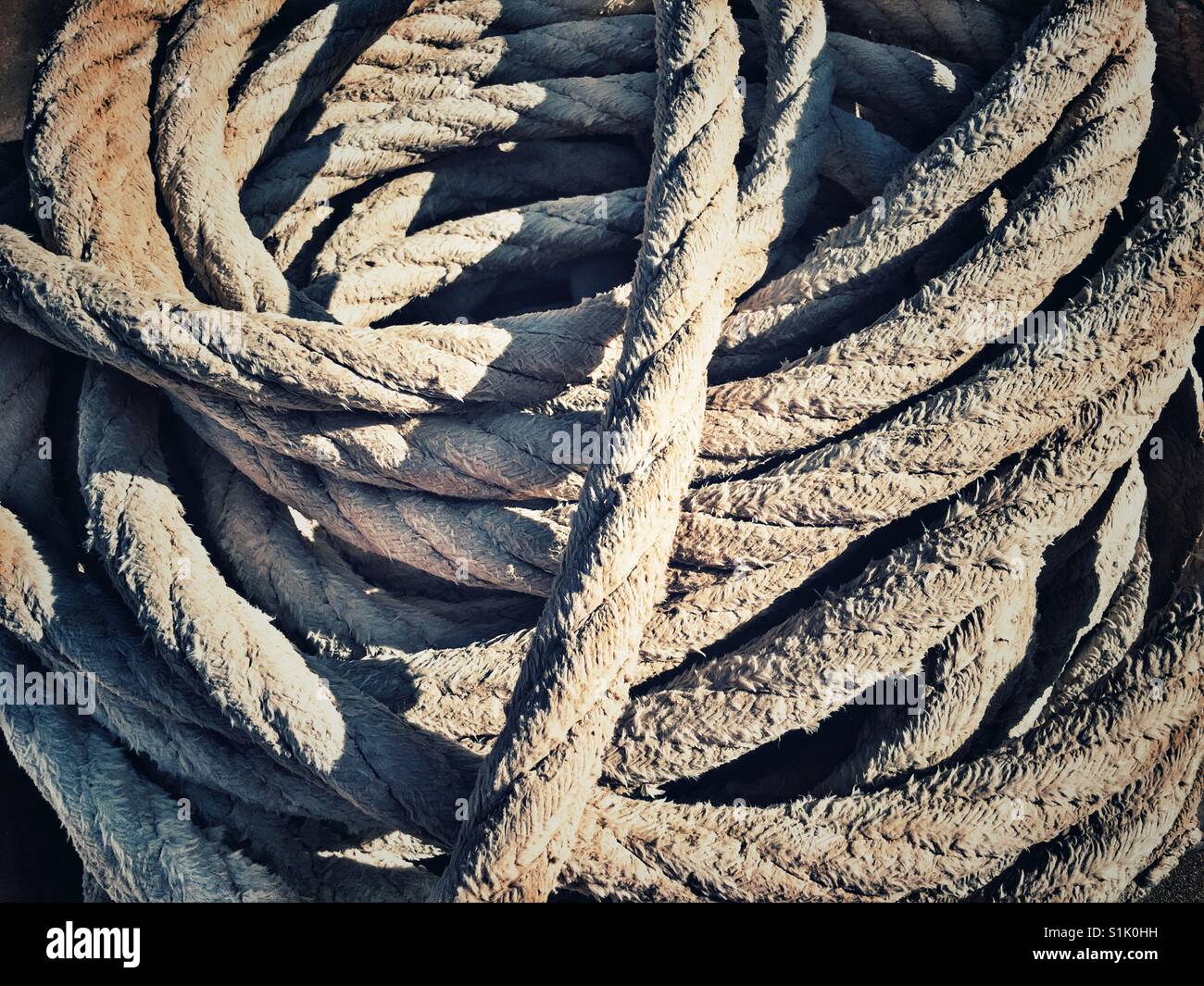 Coil of old rope Stock Photo - Alamy