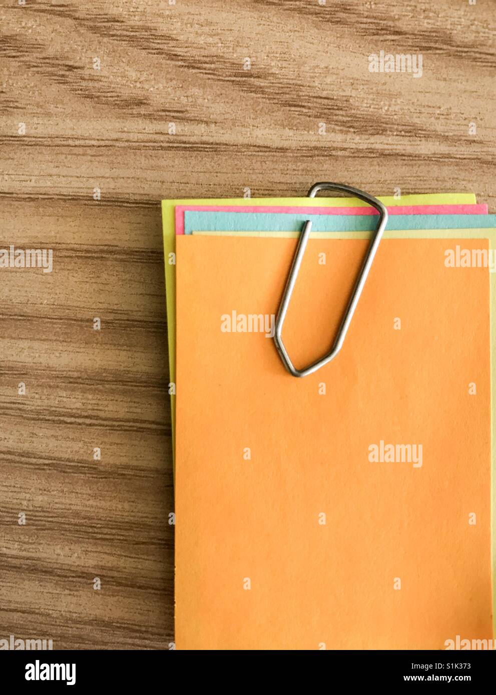 Papers attached by a clip Stock Photo - Alamy