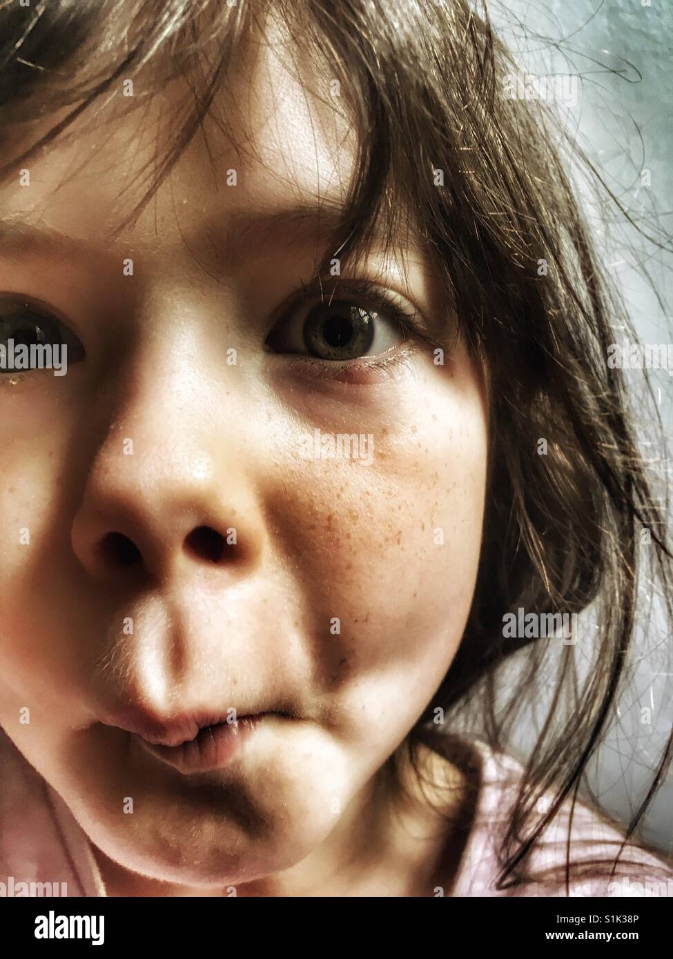 Girl sucking on a sweet Stock Photo - Alamy