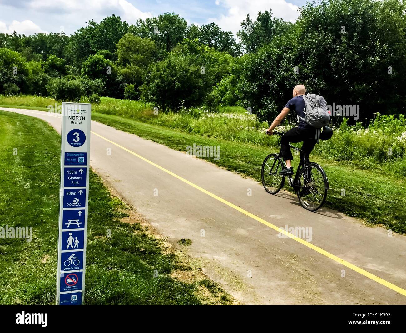 Happy trails: a cyclist on a path in the Green belt, Ontario, Canada ...