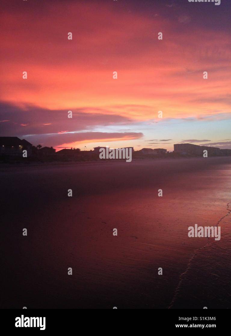 The red sunset over the beach Stock Photo - Alamy