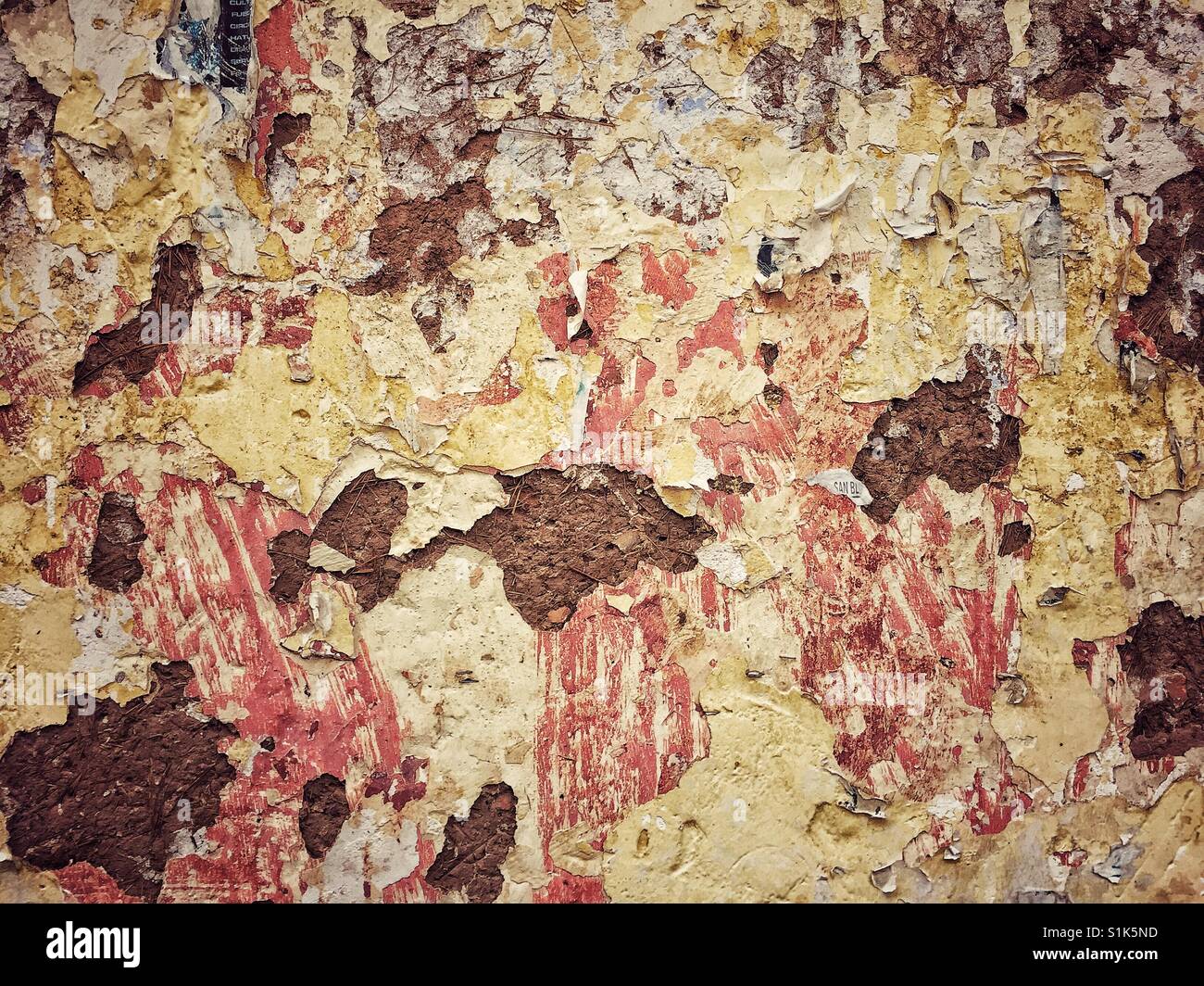 Layers of time on the wall in Cusco Stock Photo - Alamy