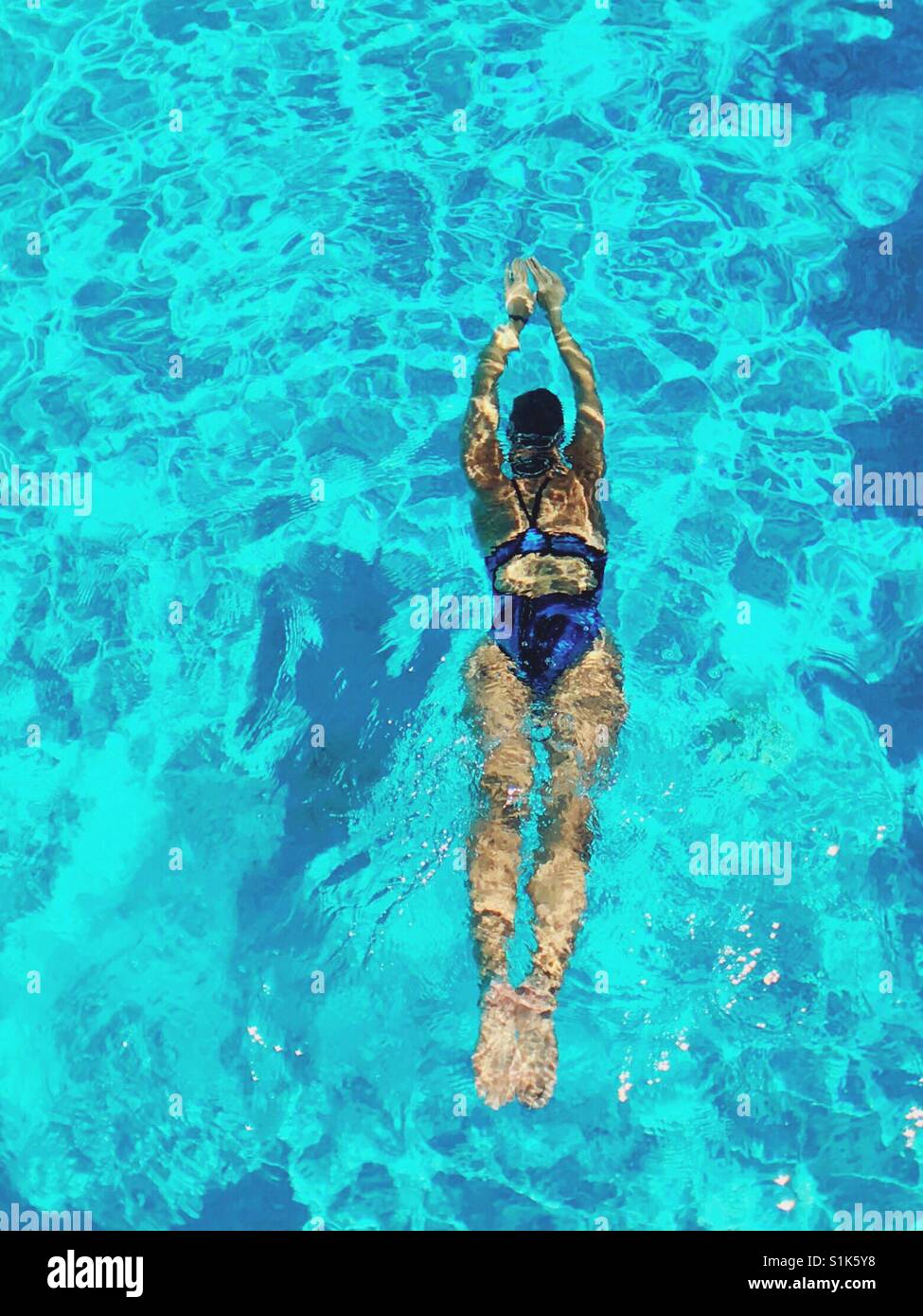 Woman swimming underwater in outdoor pool hi-res stock photography and ...