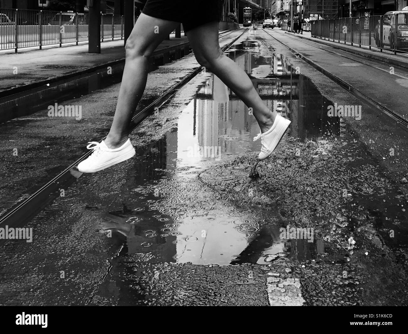 Jumping water puddle Black and White Stock Photos & Images - Alamy