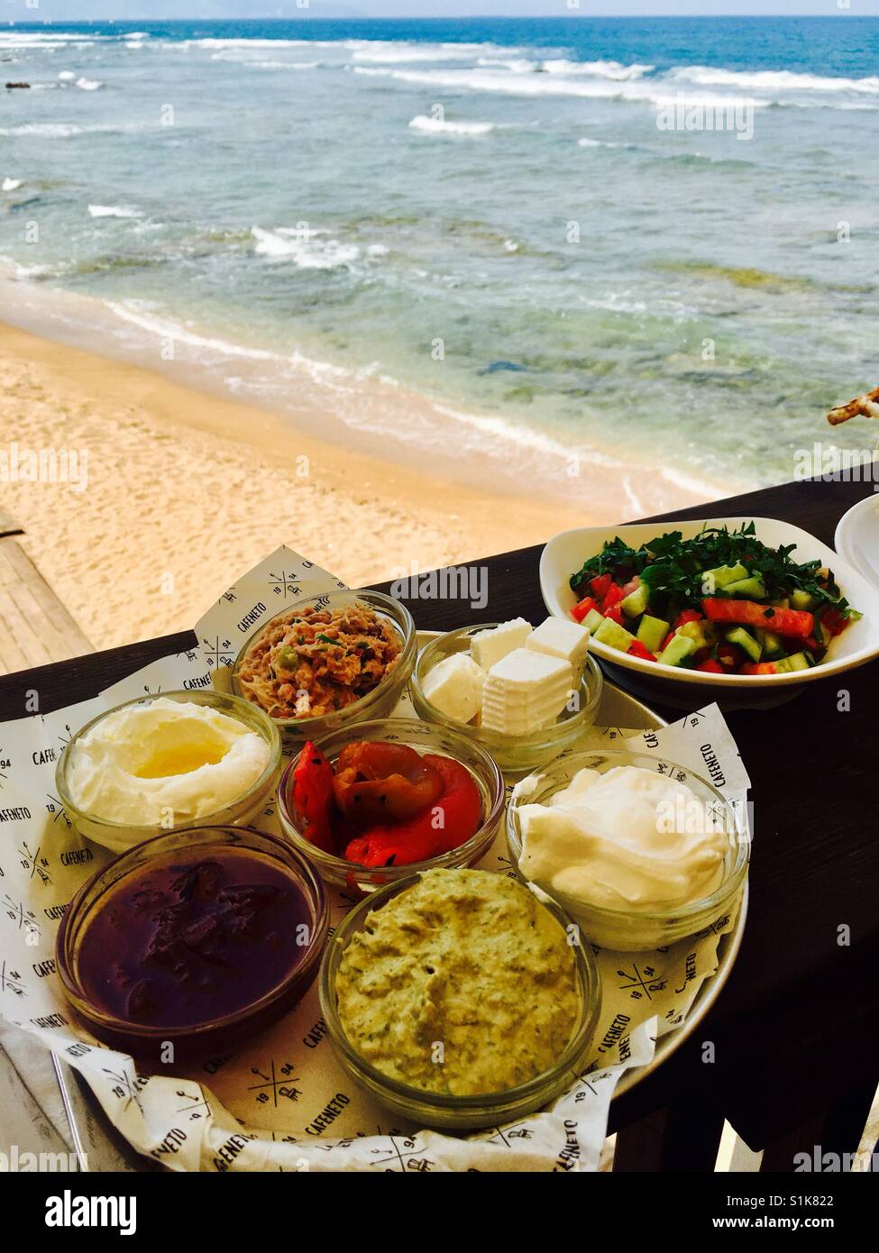 Israeli breakfast by the ocean in Acre, Israel Stock Photo - Alamy