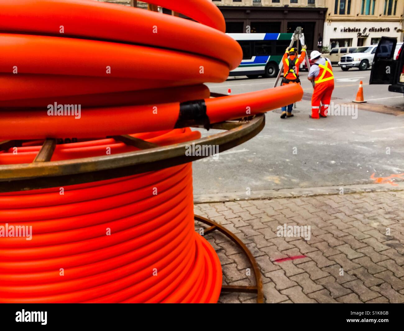 IT workers laying cable Stock Photo - Alamy