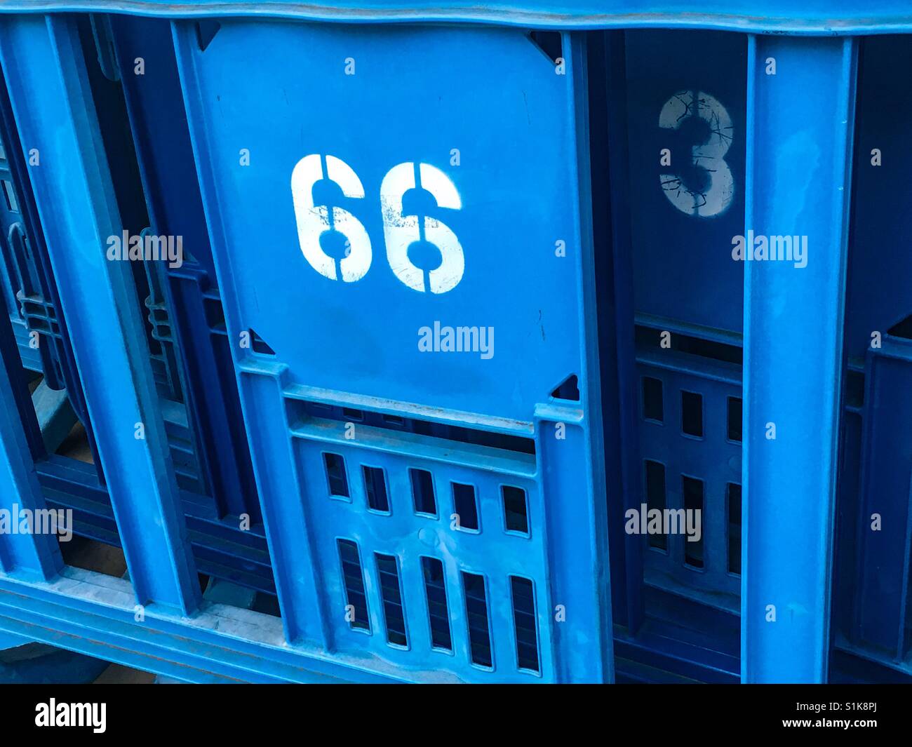 Number 66 on blue plastic Stock Photo - Alamy