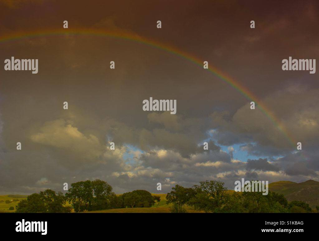 Dark skies with rainbow hi-res stock photography and images - Alamy