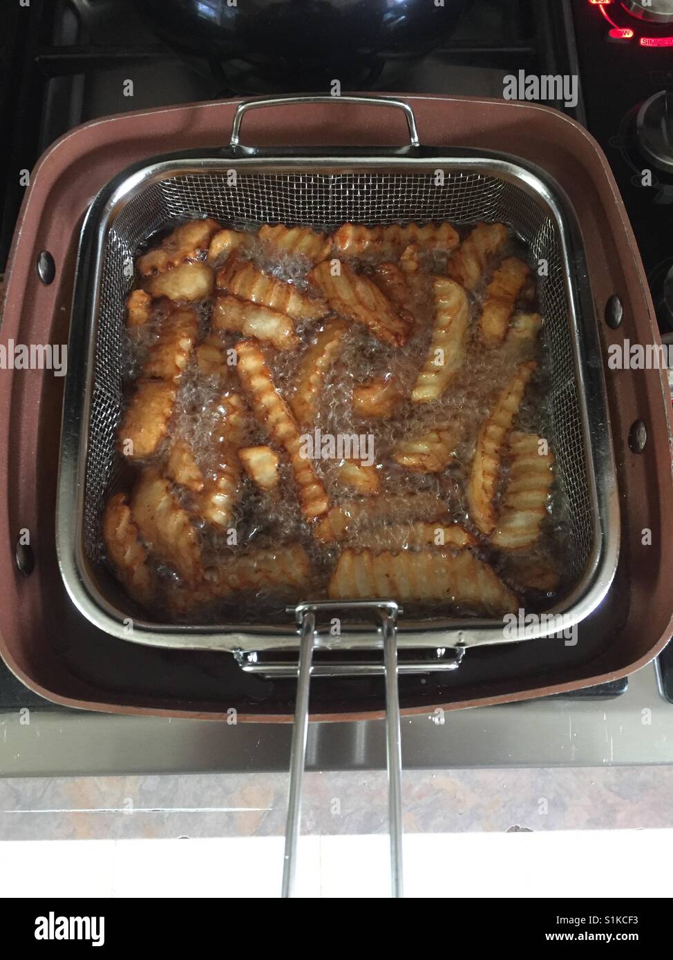 French fries cooking hi-res stock photography and images - Alamy