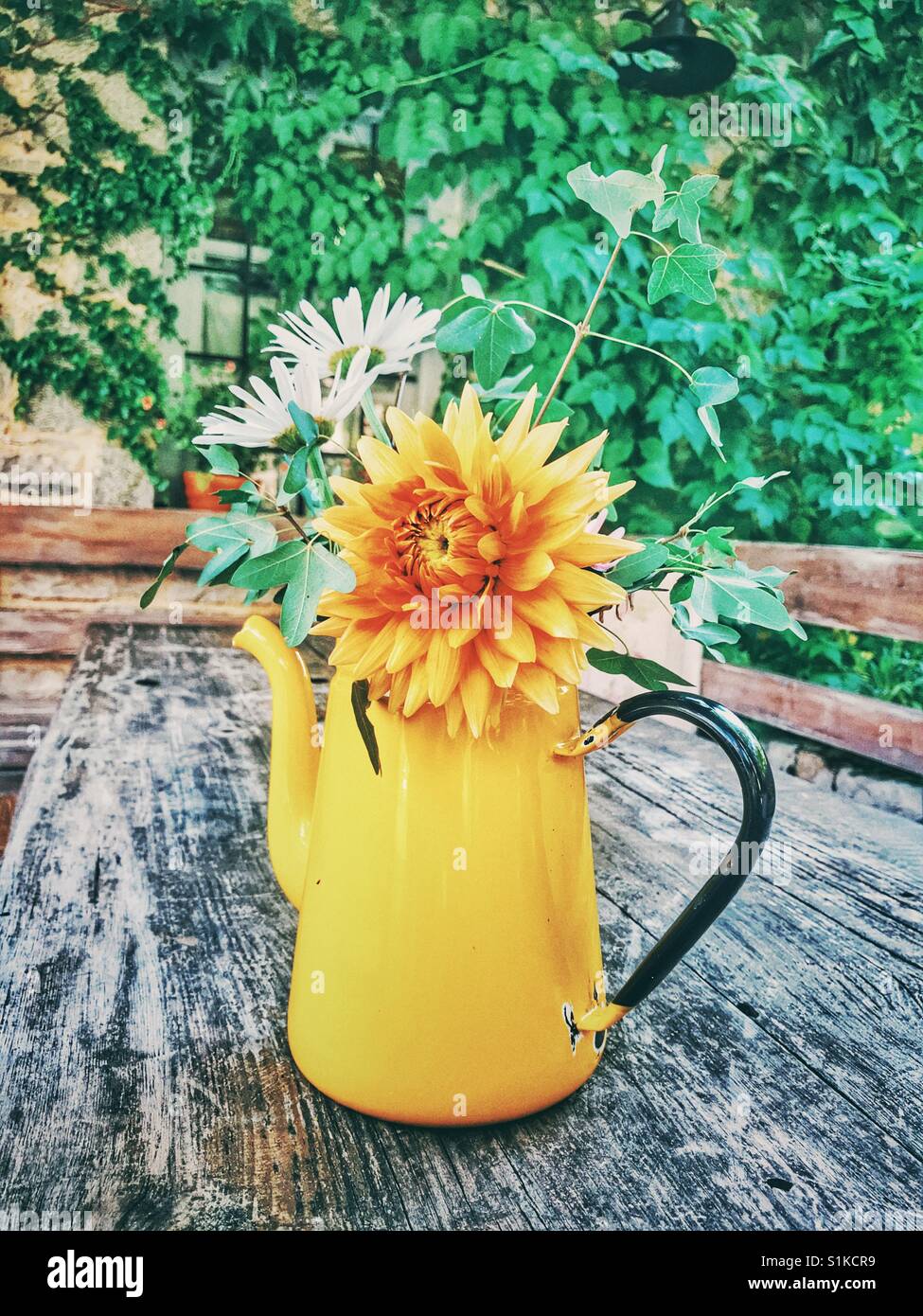 Watering can with flowers hi-res stock photography and images - Alamy