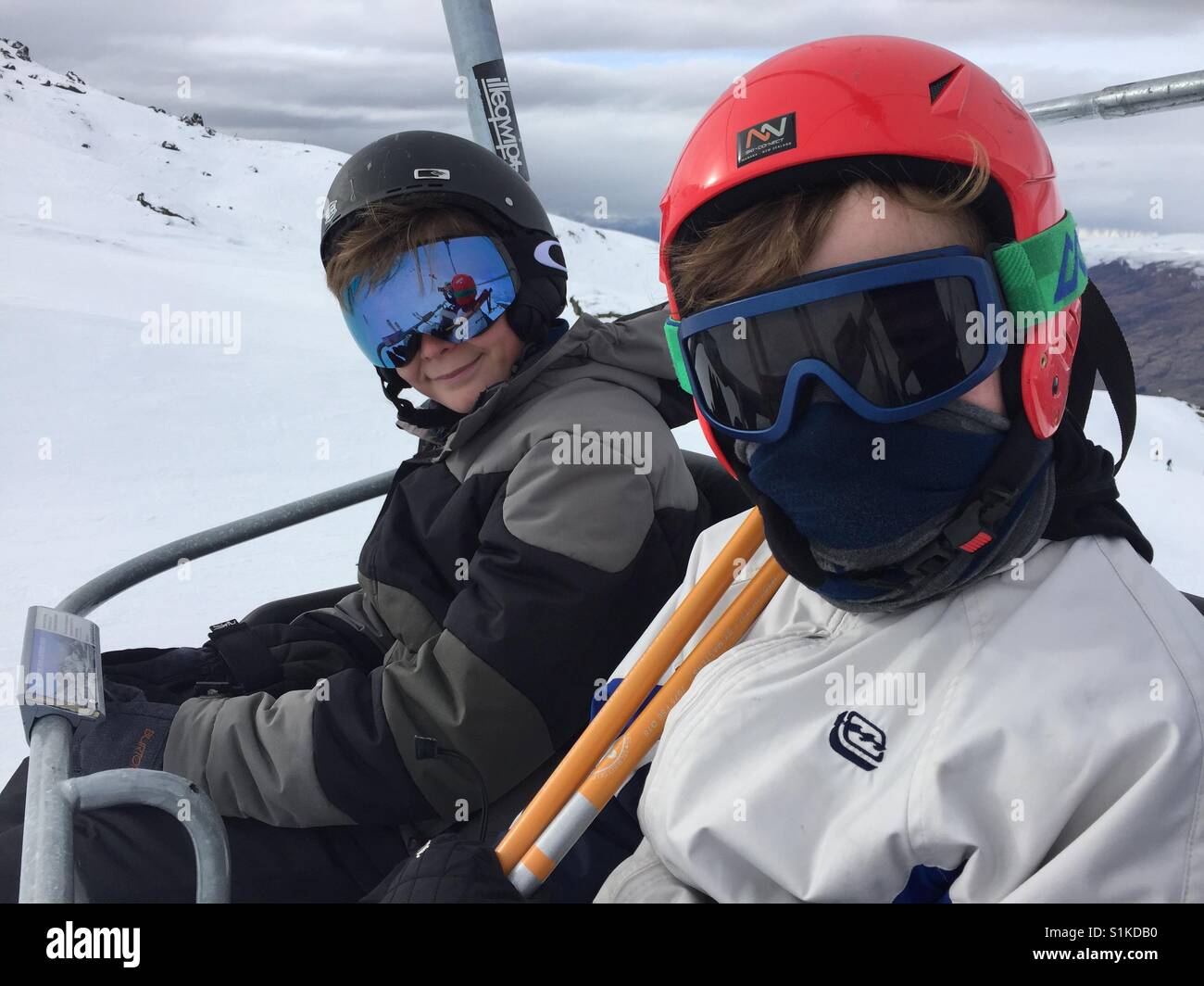 Boys on chairlift Stock Photo - Alamy