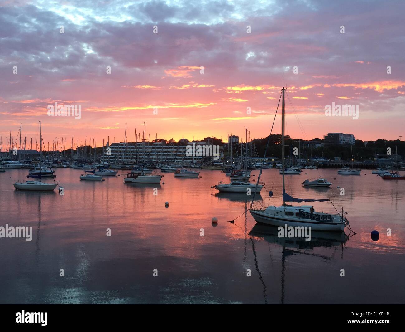 PLYMOUTH, U.K. 17th July 2017. Stunning orange sunset over Devonport ...