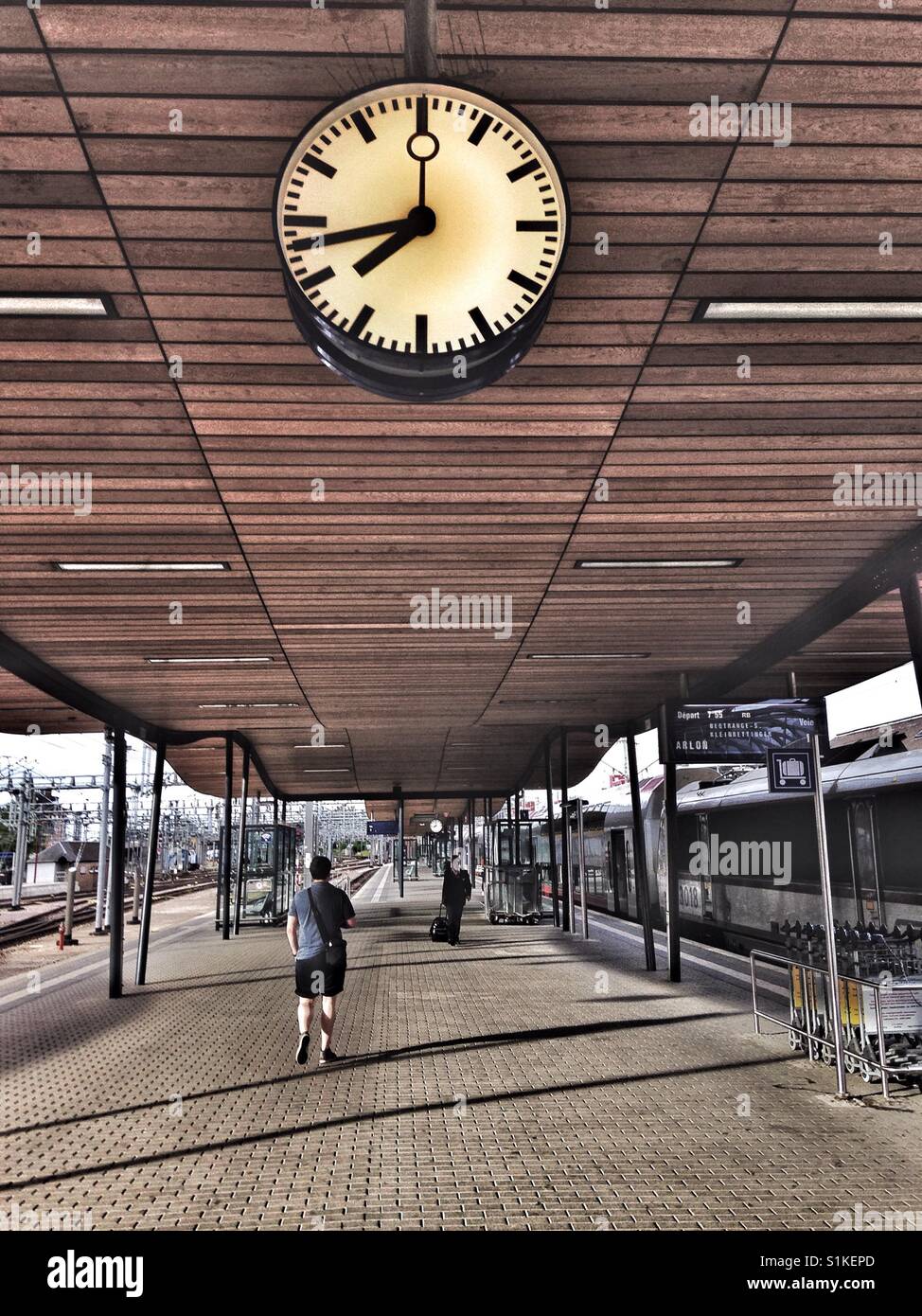 At the train station Stock Photo - Alamy