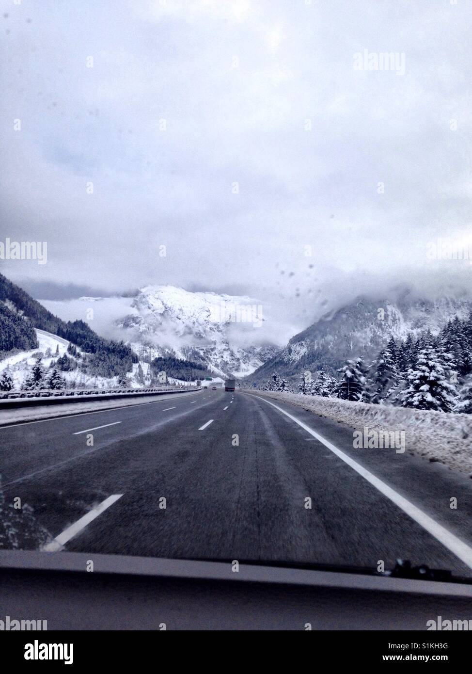 Snow on highway Stock Photo - Alamy