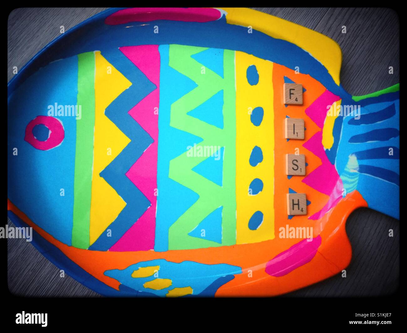 Bold-coloured plastic fish tray Stock Photo - Alamy