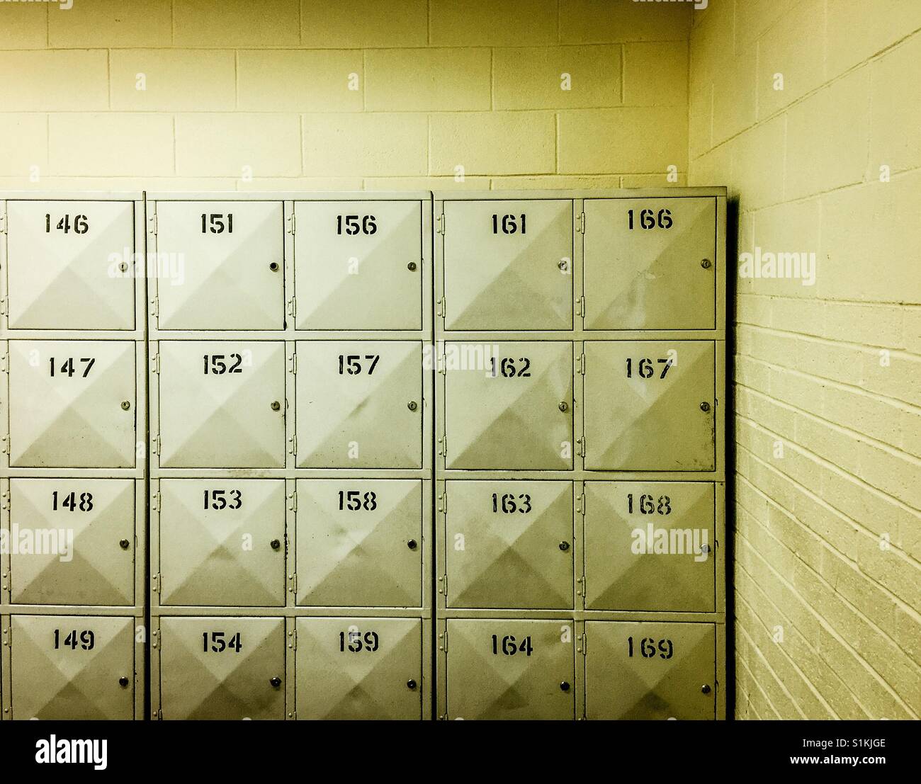 Numbered yellow square sports lockers Stock Photo - Alamy