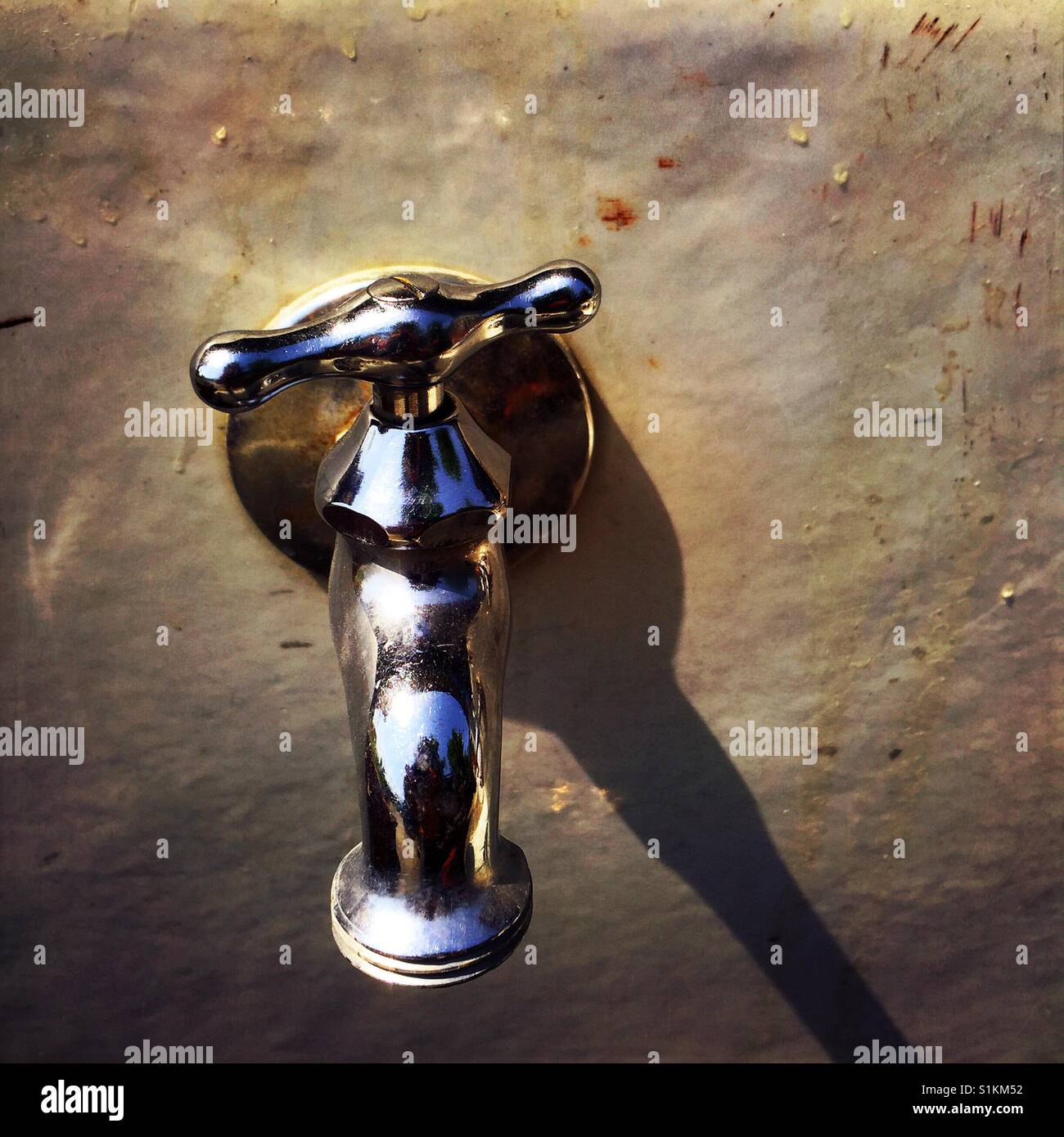 A Close Up Shot Of An Old Fashioned Water Faucet Over A Sink Stock